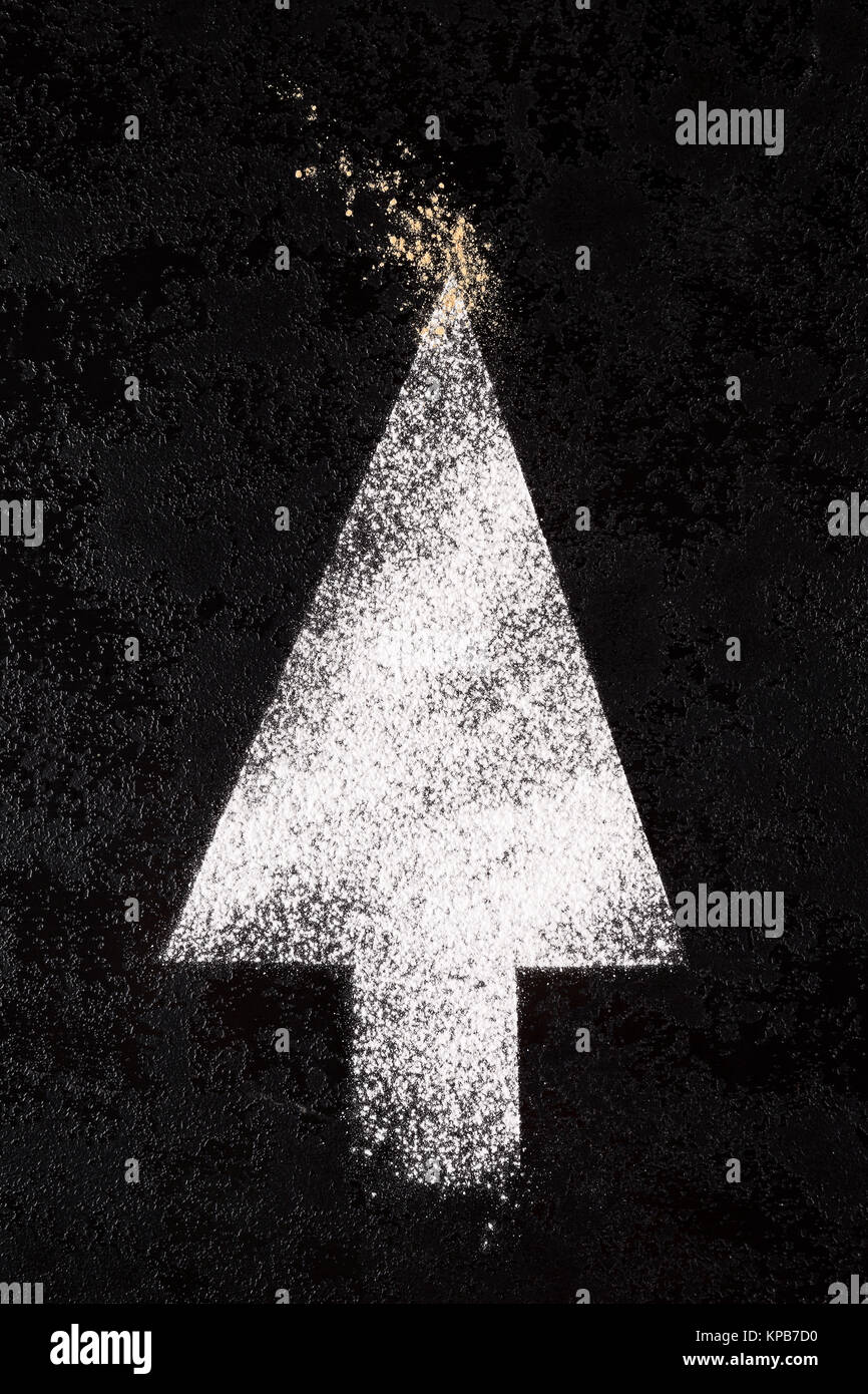 Minimal christmas tree made from sugar on dark surface from above Stock ...