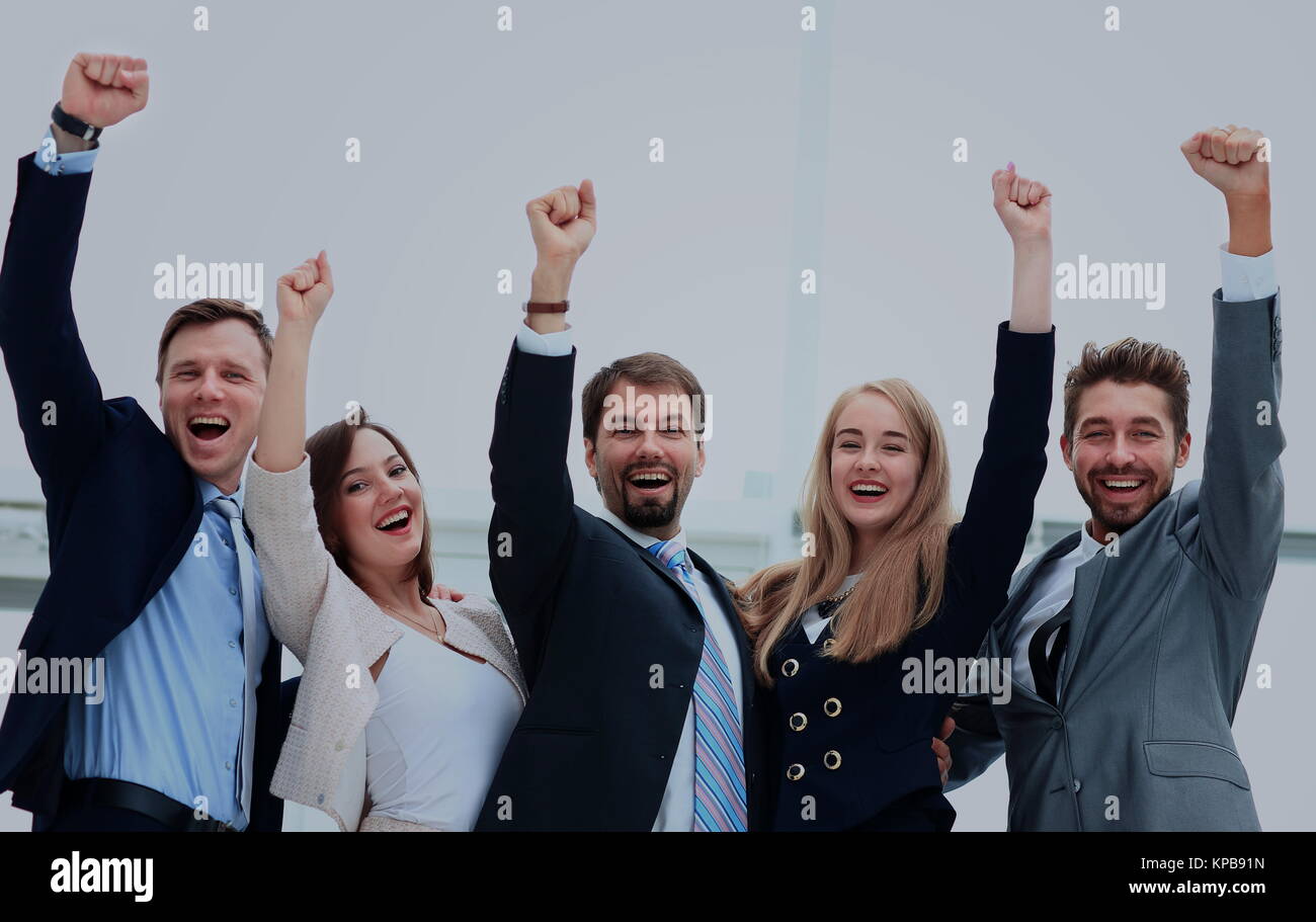 Business team celebrating a triumph with arms up Stock Photo - Alamy