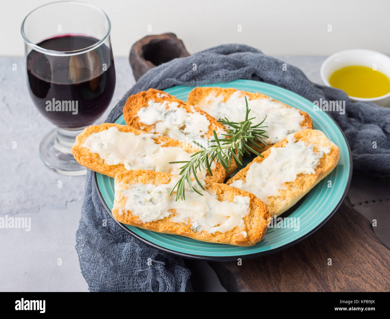 Italian toasts with gorgonzola cheese on rustic background with wine ...