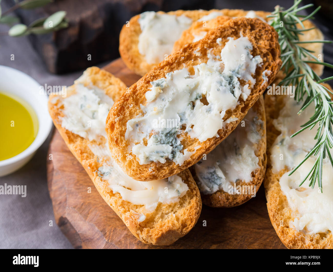 Italian toasts with gorgonzola cheese on rustic background with wine ...