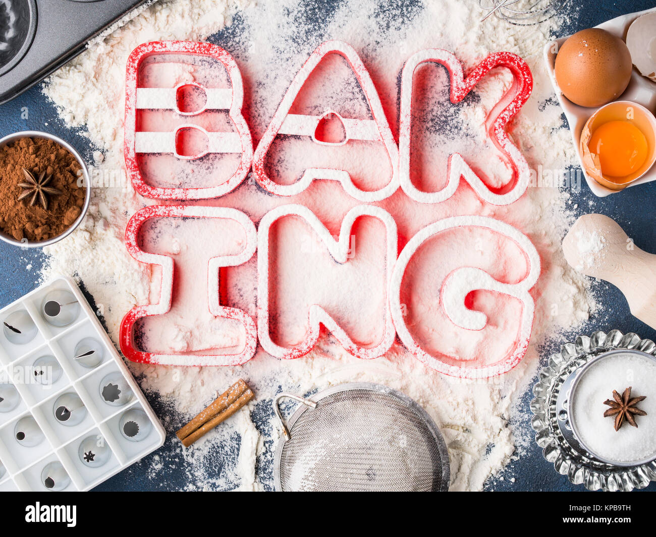 Flour letters spelling Baking with tools and sweet food ingredients ...