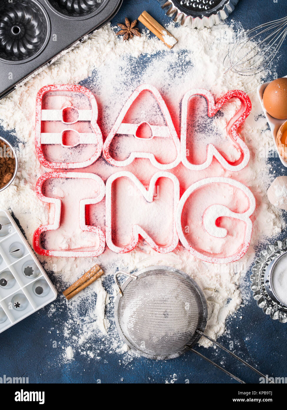 Flour letters spelling Baking with tools and sweet food ingredients ...