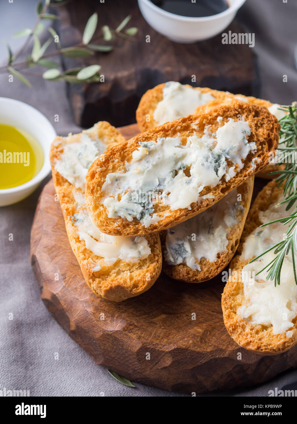 Italian toasts with gorgonzola cheese on rustic background with wine ...