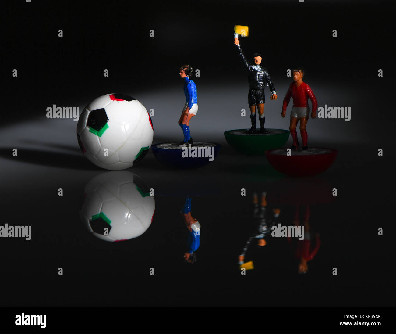 Offside rule shown with Subbuteo players and linesman Stock Photo - Alamy