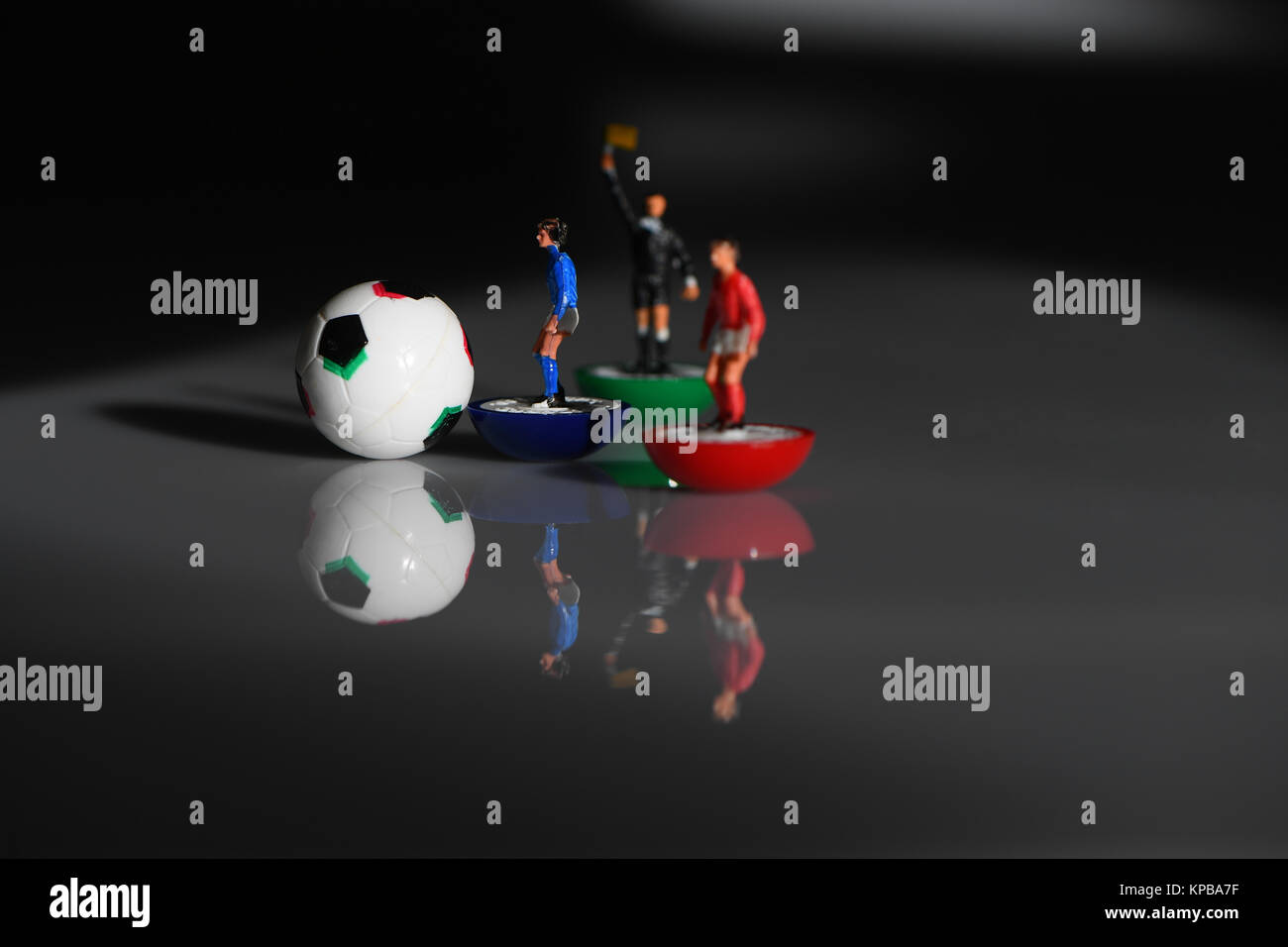 Offside rule shown with Subbuteo players and linesman Stock Photo - Alamy