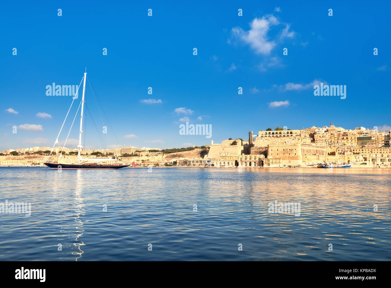 Sailing ship enters Grand Valetta bay with a view over Valetta's ...