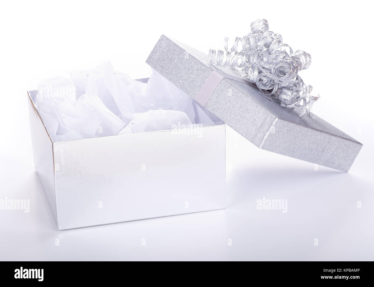 Opened silver gift box on a white background Stock Photo - Alamy