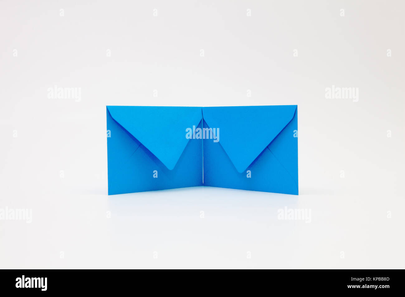 Blue envelopes and on the white table Stock Photo - Alamy