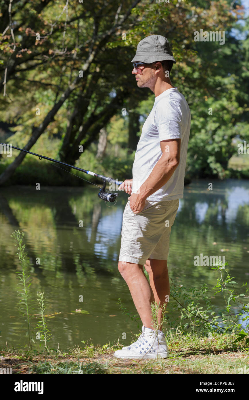 man fishing at the lake Stock Photo - Alamy