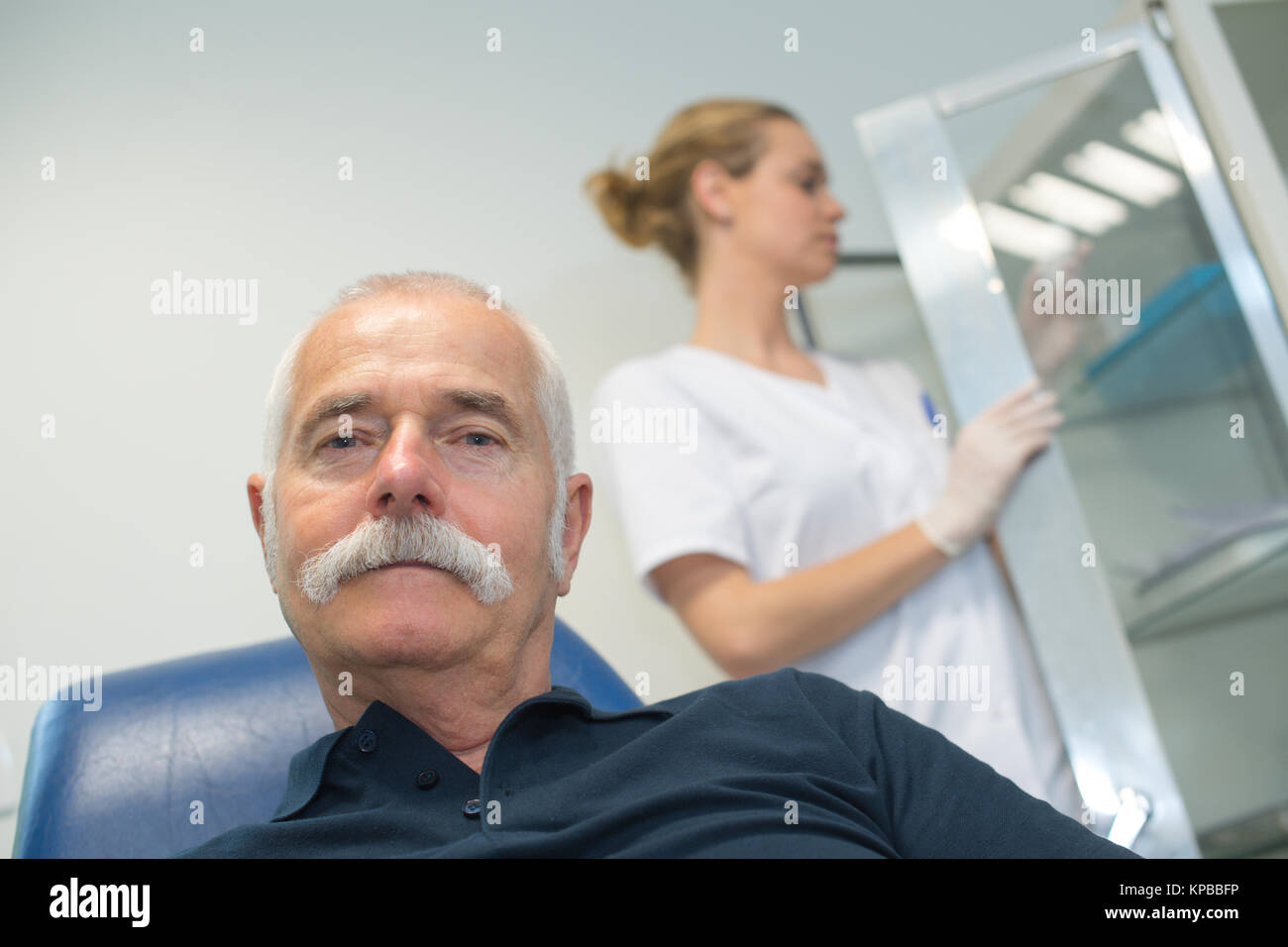 old man waiting on the clinic for blood extraction Stock Photo - Alamy