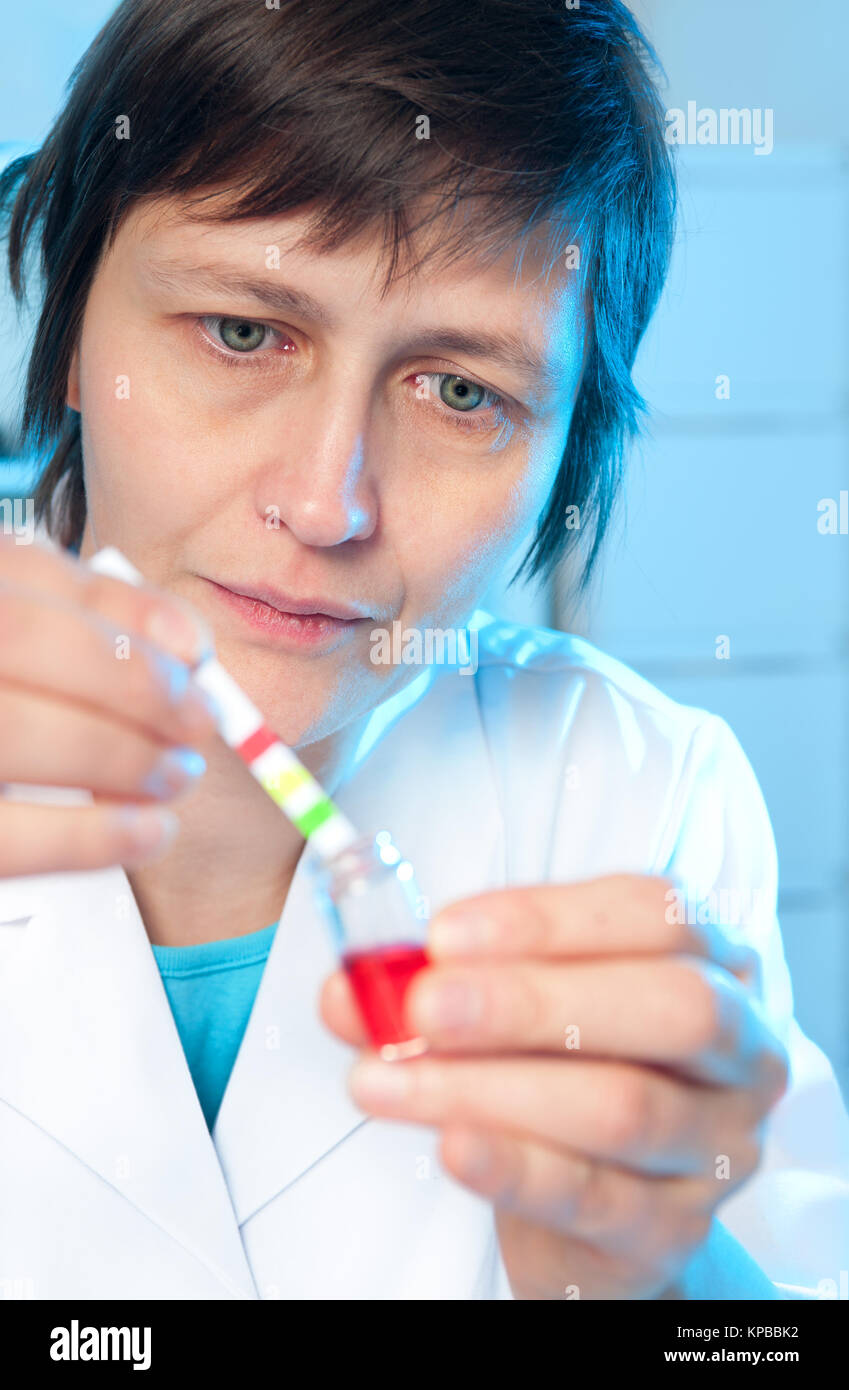 Portrait of a senior scientist or tech measuring pH of a sample Stock ...