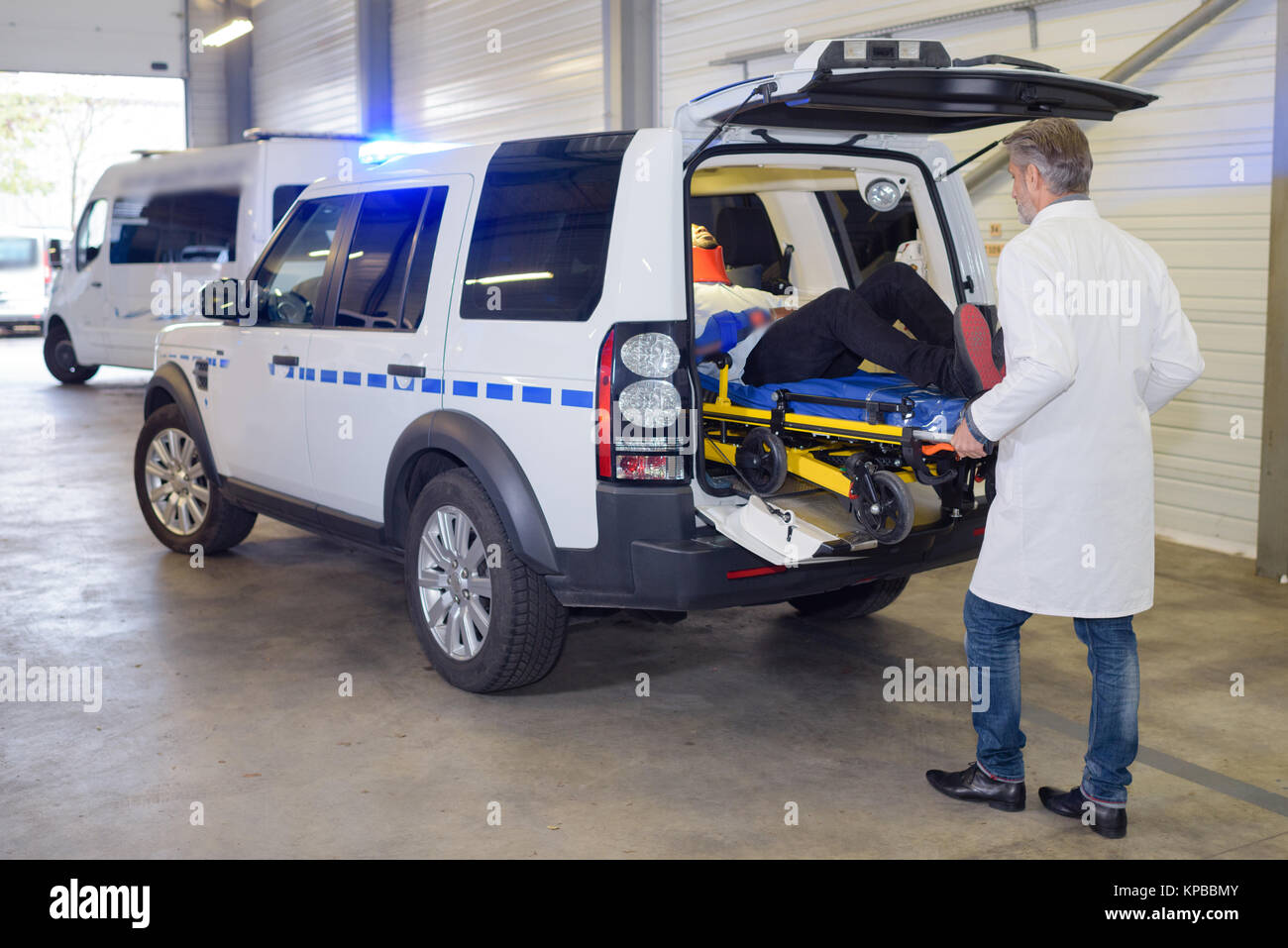 paramedics offloading patient from an ambulance Stock Photo - Alamy