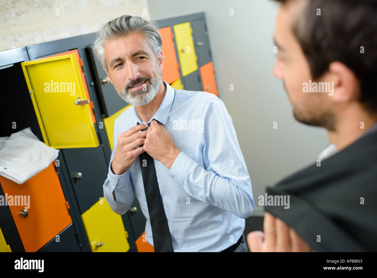 businessman in a modern wood interior of a locker Stock Photo - Alamy