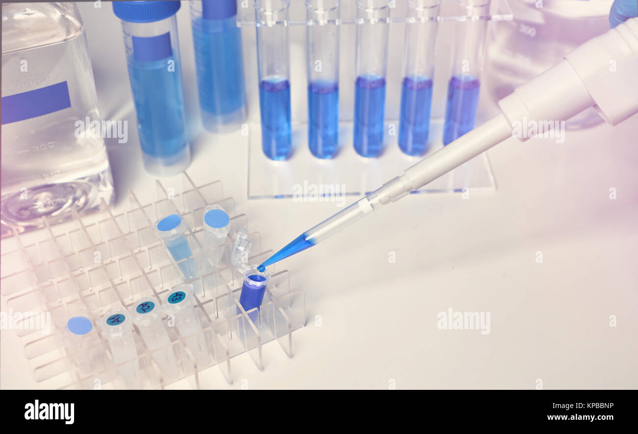 Scientific background in blue and white. Liquid sample loading with ...