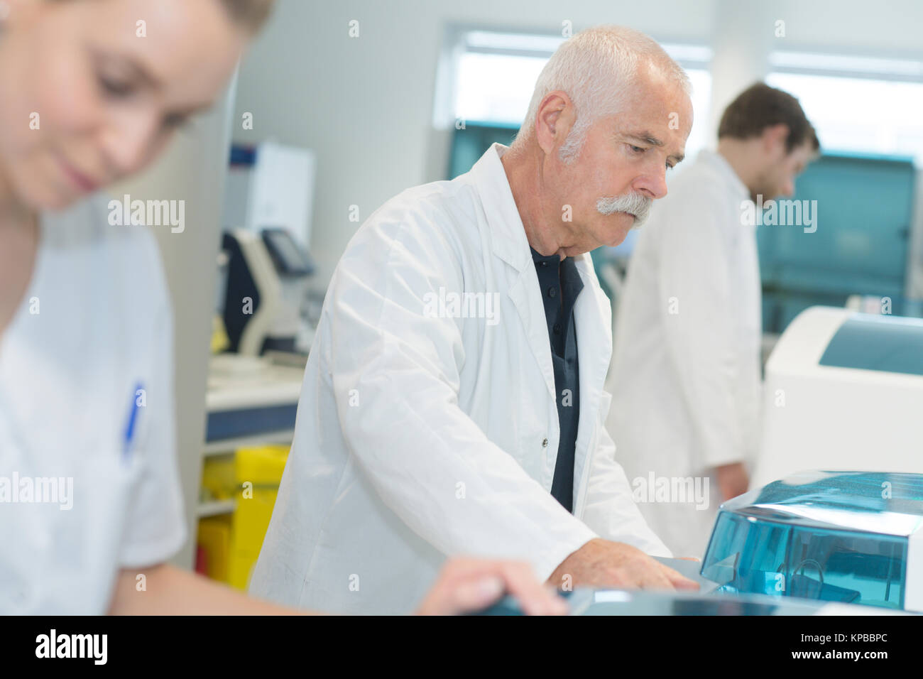 Senior man working in laboratory Stock Photo - Alamy