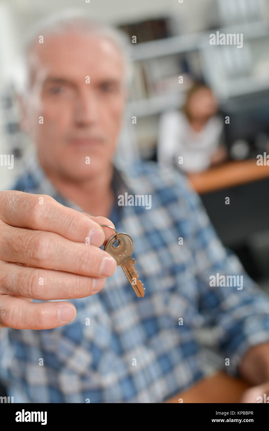 Handing over house key Stock Photo - Alamy
