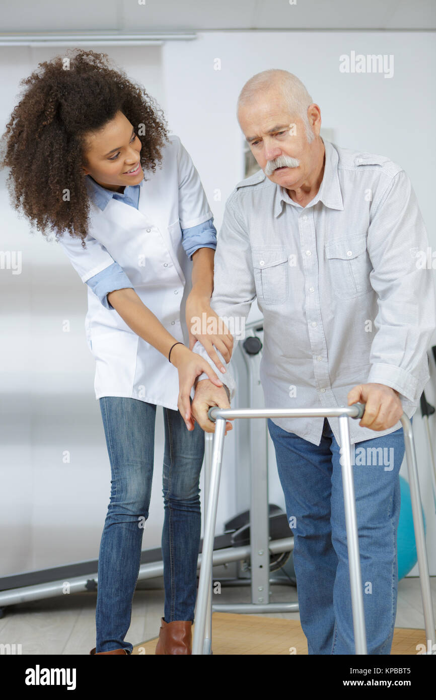 Helping patient walk hi-res stock photography and images - Alamy