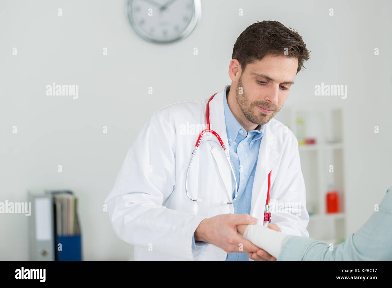 doctor fixing female patients wrist splint Stock Photo - Alamy