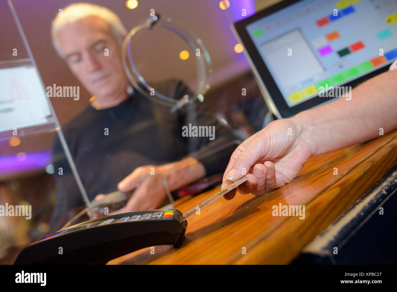 Card payment at ticket booth Stock Photo - Alamy