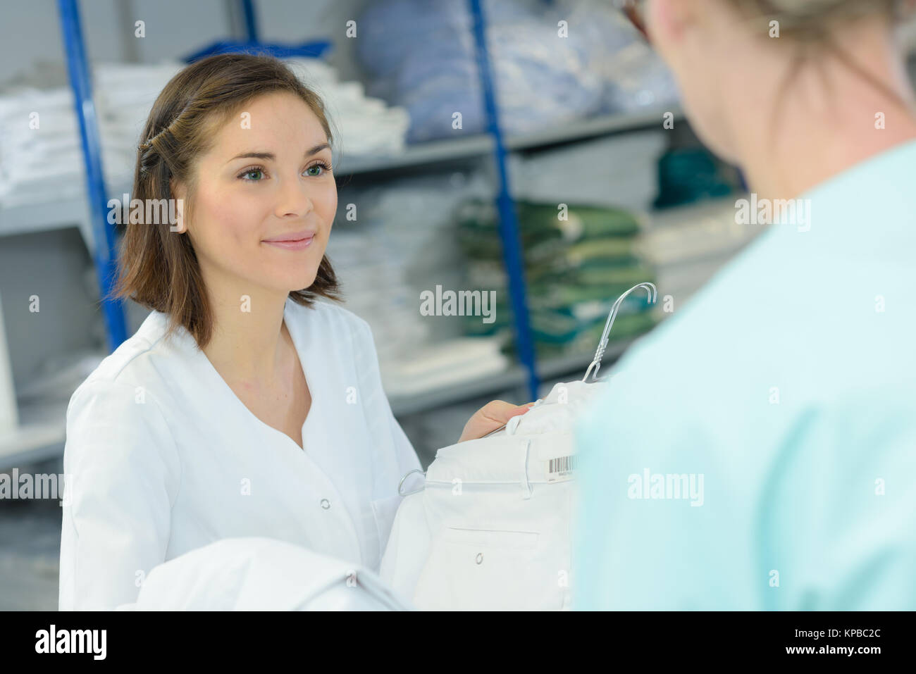 women employees in professional laundry Stock Photo - Alamy