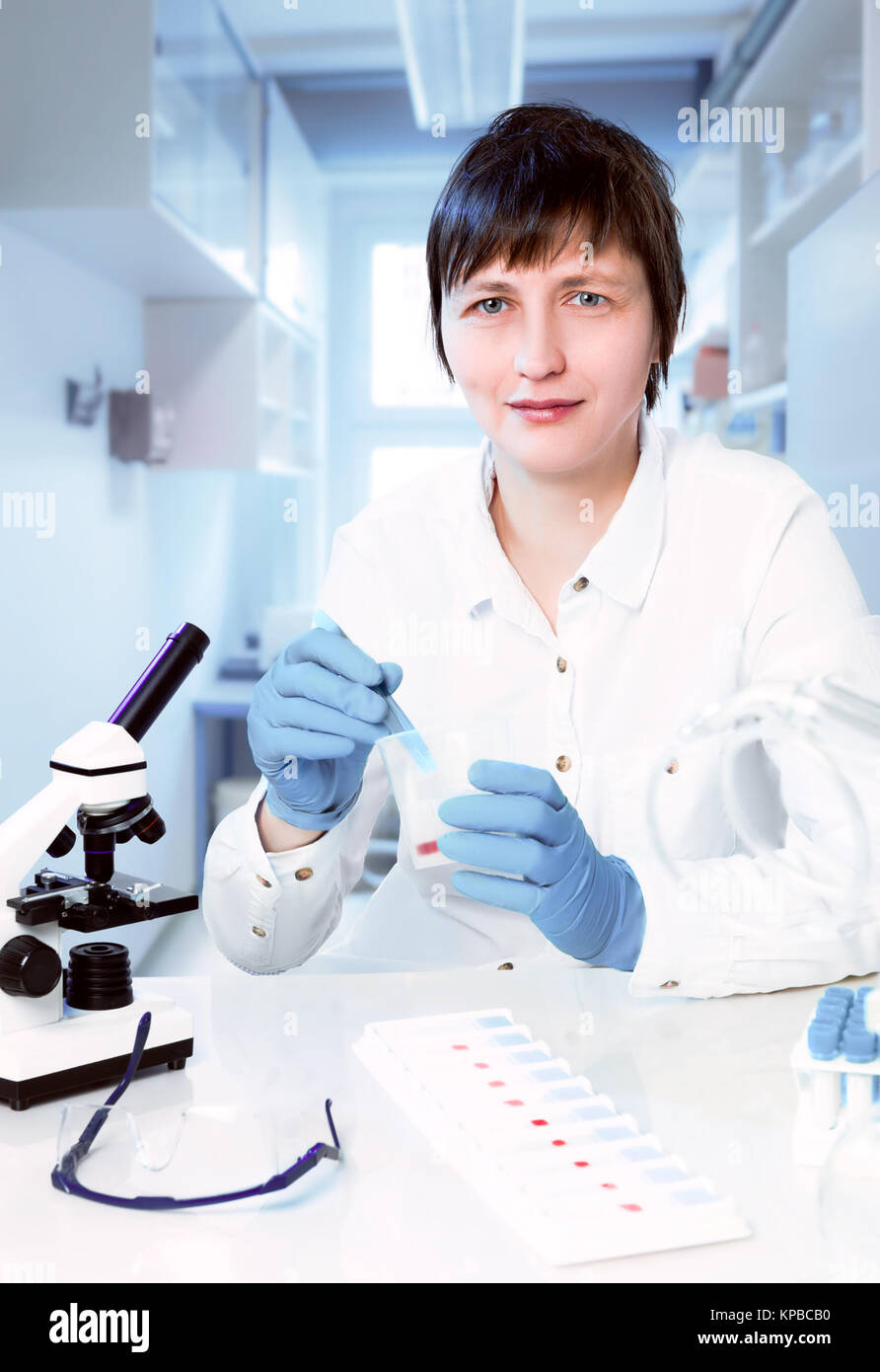 Histopathologist or microscopist works with tissue samples Stock Photo ...