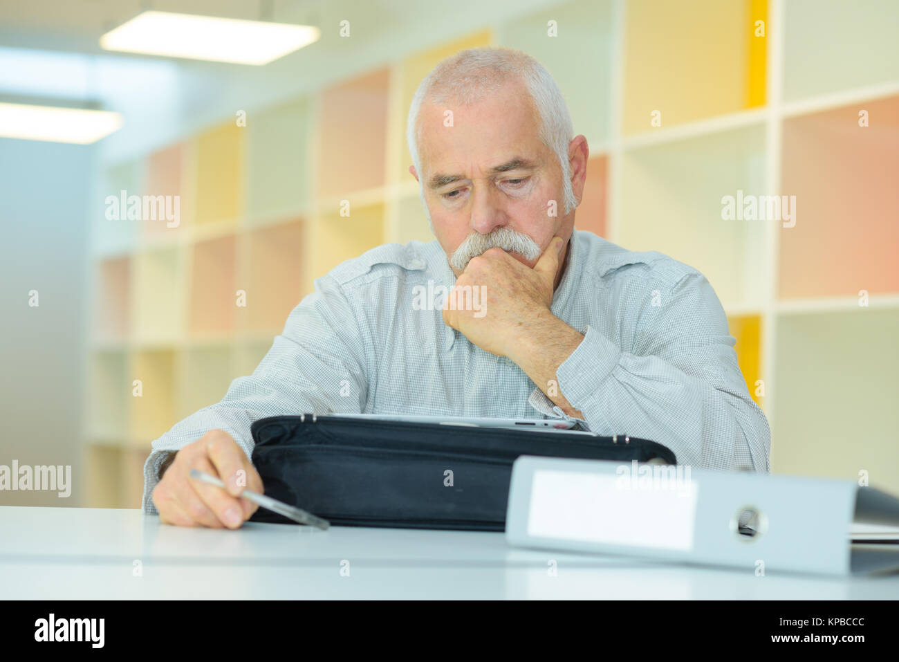 senior man checking his papers Stock Photo - Alamy