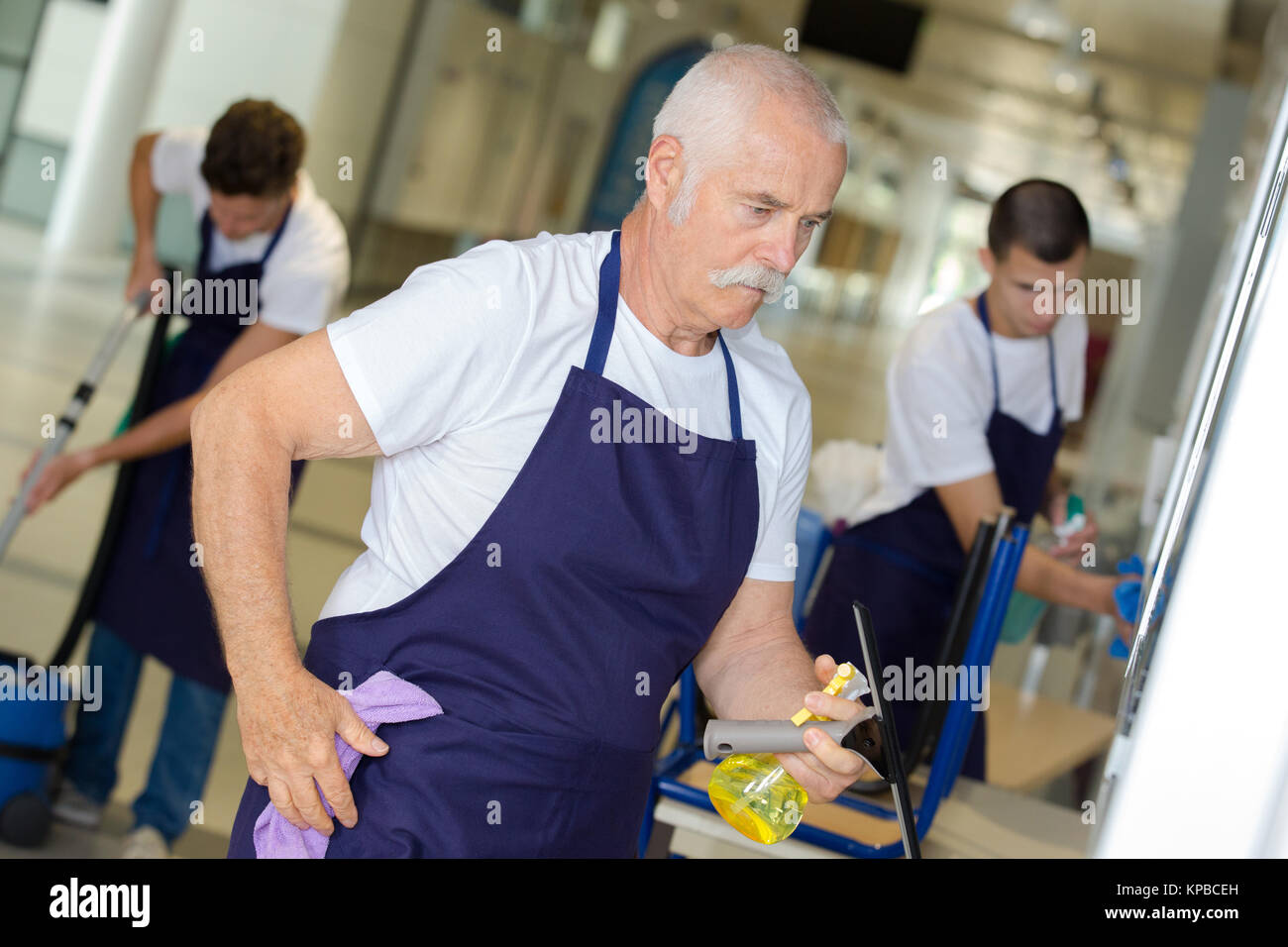 successful teamwork of cleaning services workers Stock Photo - Alamy