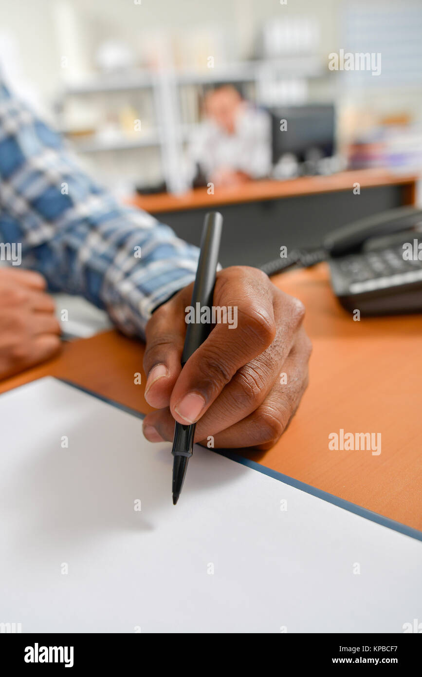 About to sign a document Stock Photo - Alamy