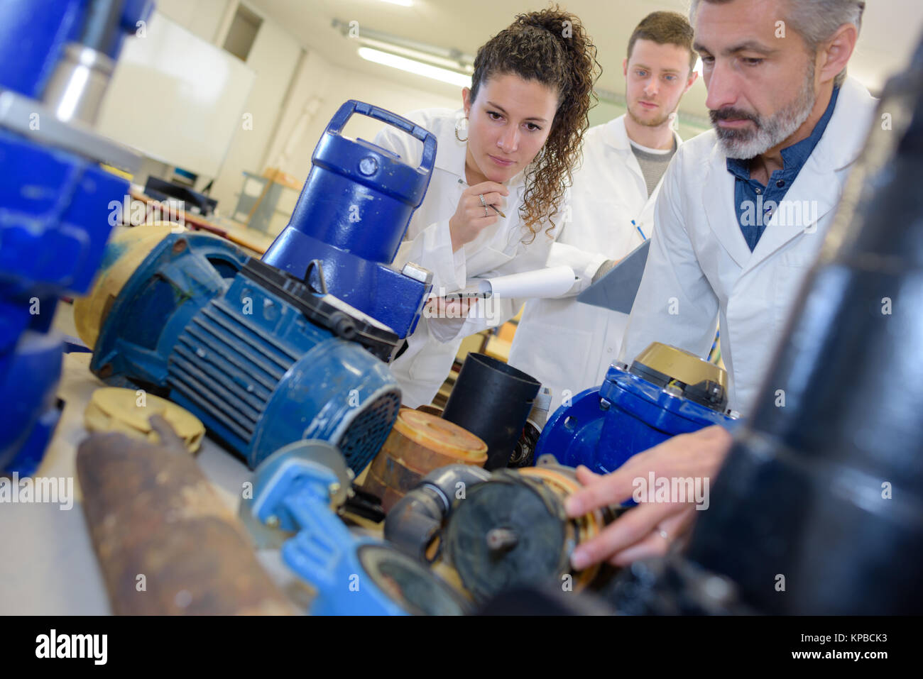 man with students engineers Stock Photo - Alamy