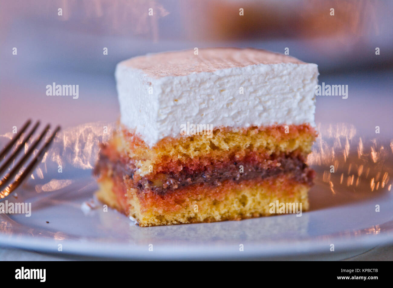 slice of cake with cream, sponge cake, chocolate and strawberry juice ...