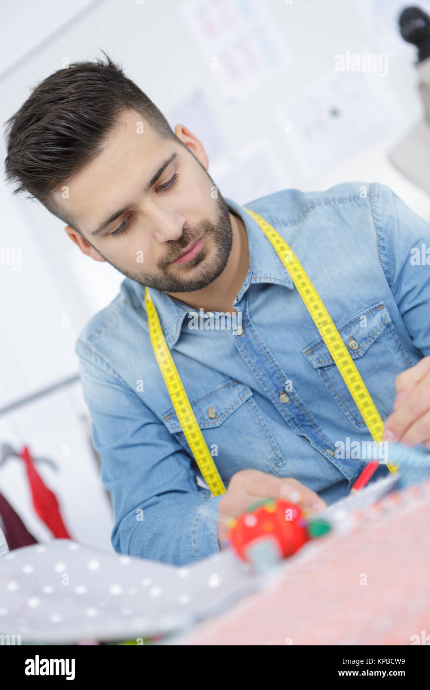 smiling male dressmaker Stock Photo - Alamy