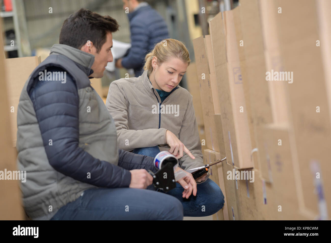 clerk inspecting the boxes Stock Photo - Alamy