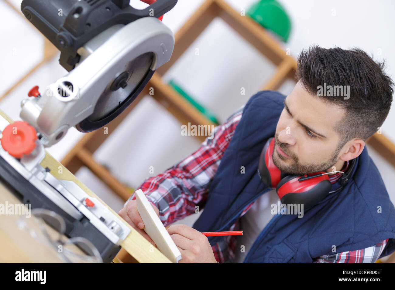 male carpenter with note pad at workshop Stock Photo - Alamy