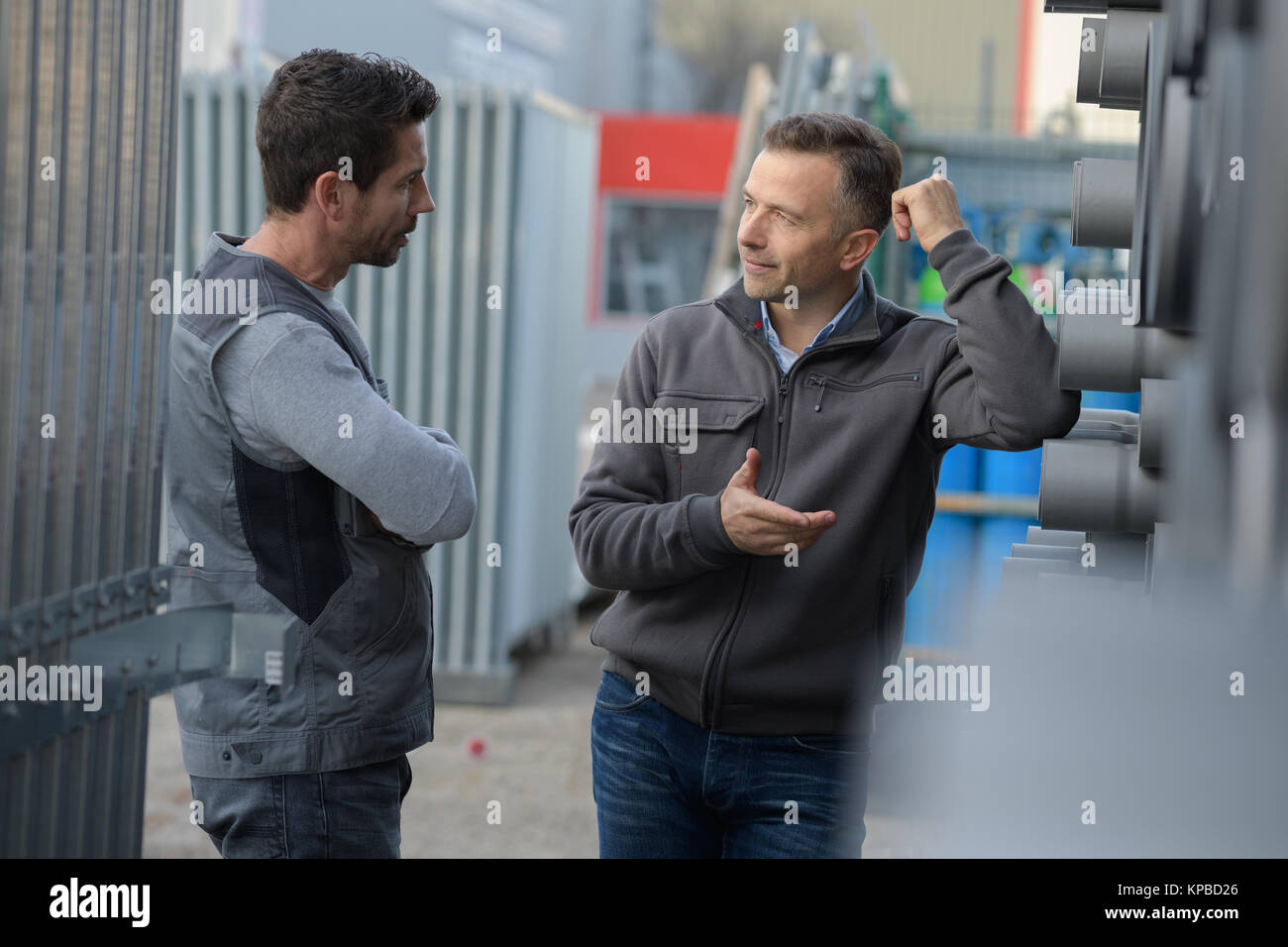 Industrial employees talking in factory hi-res stock photography and ...