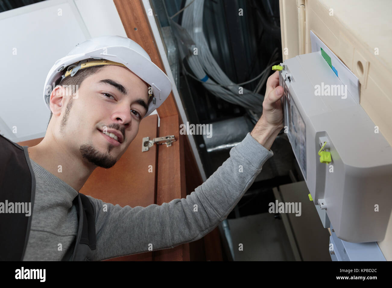 portrait of a happy young male electrician Stock Photo - Alamy
