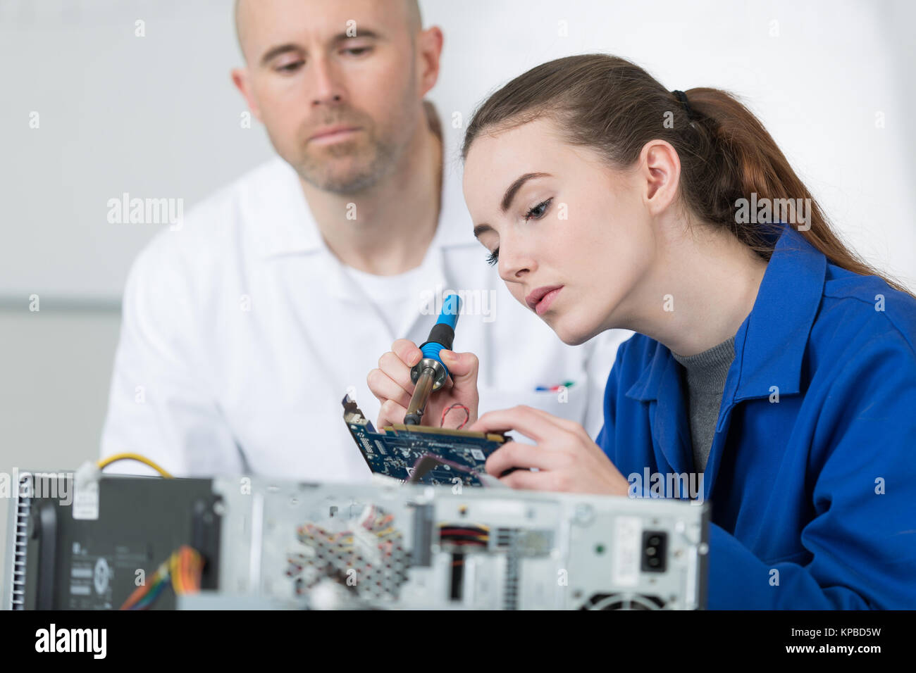female repairing part of computer components Stock Photo - Alamy