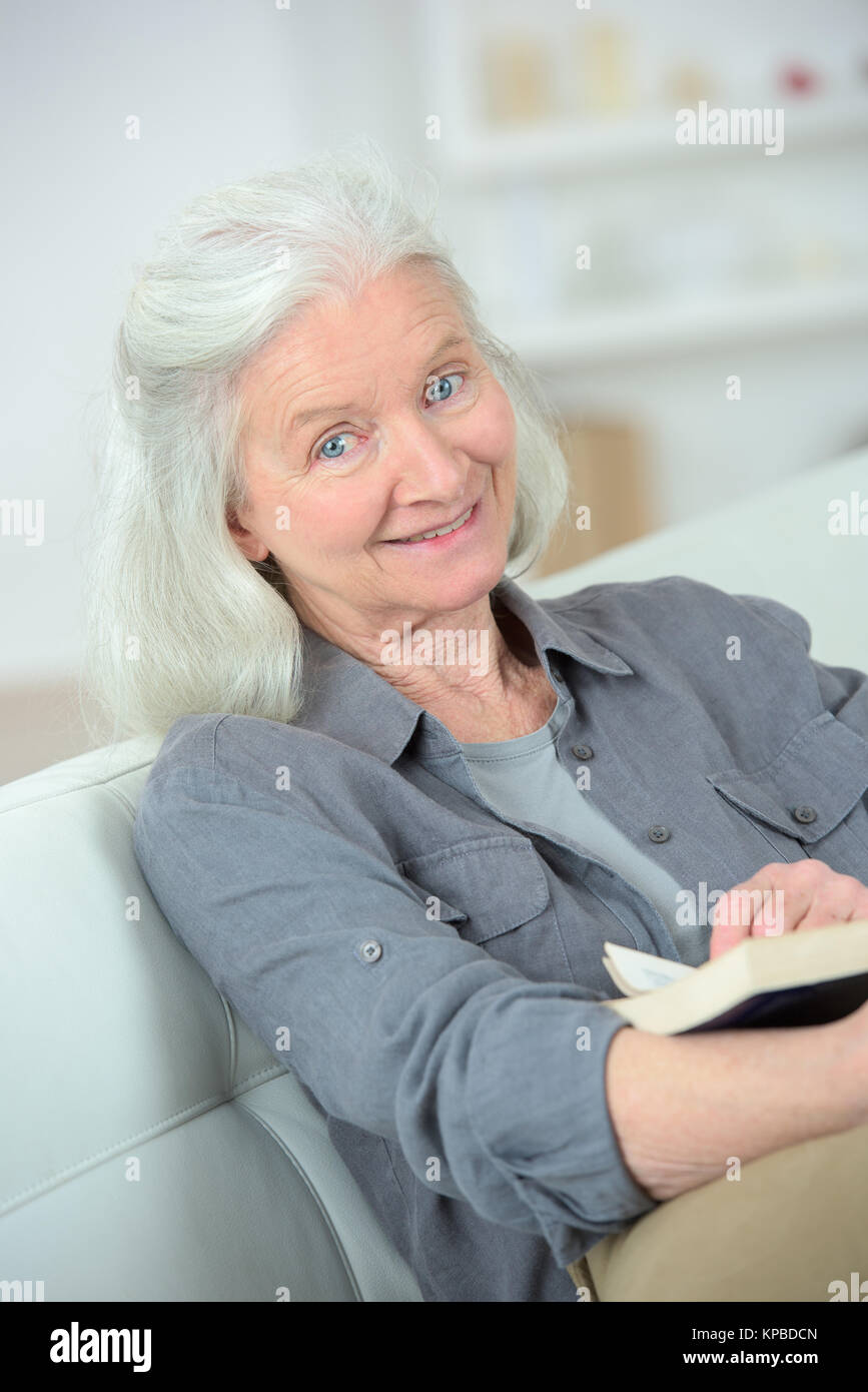 Elderly woman flipping page hi-res stock photography and images - Alamy