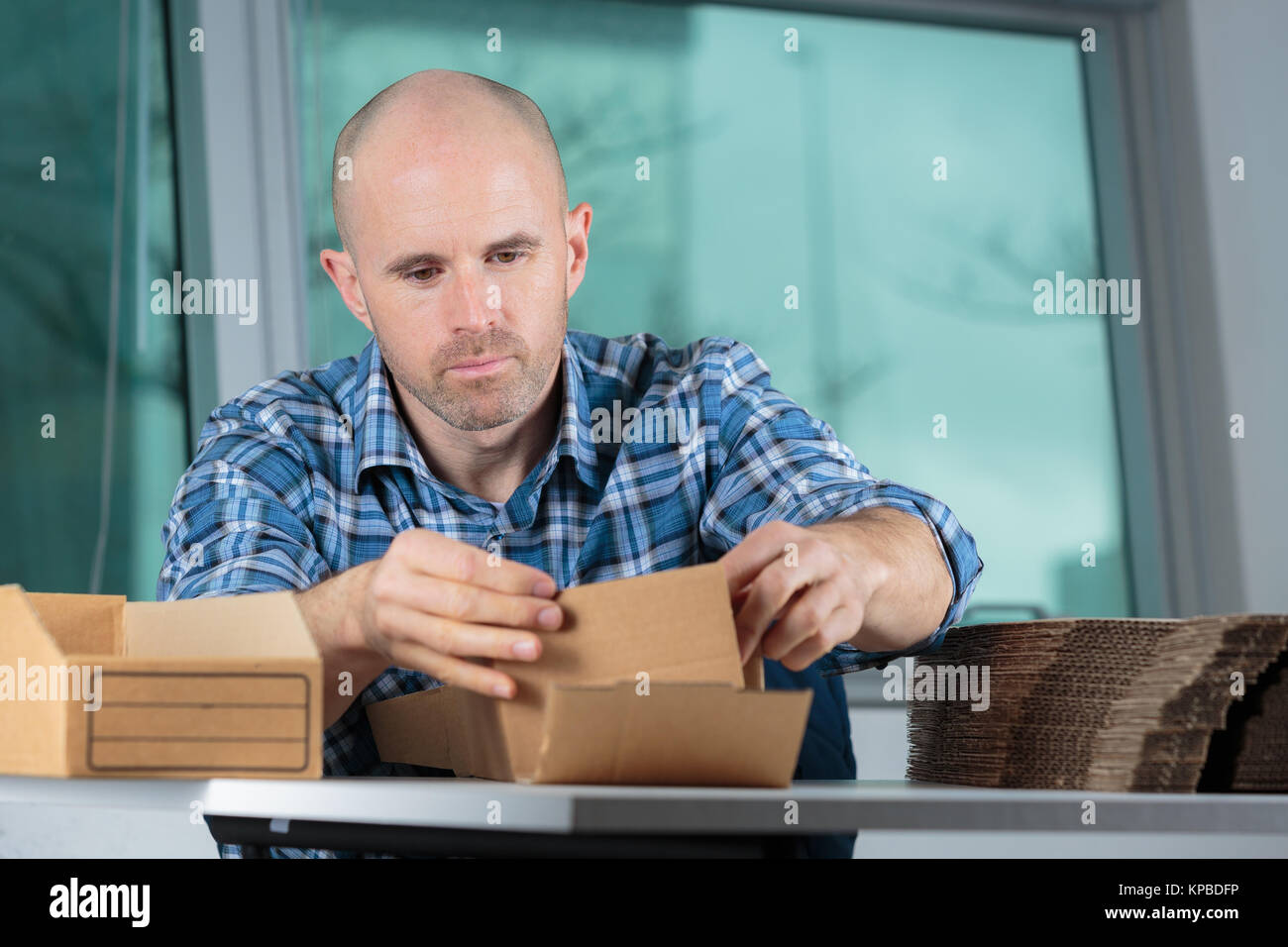 man preparing boxes for delivery Stock Photo - Alamy