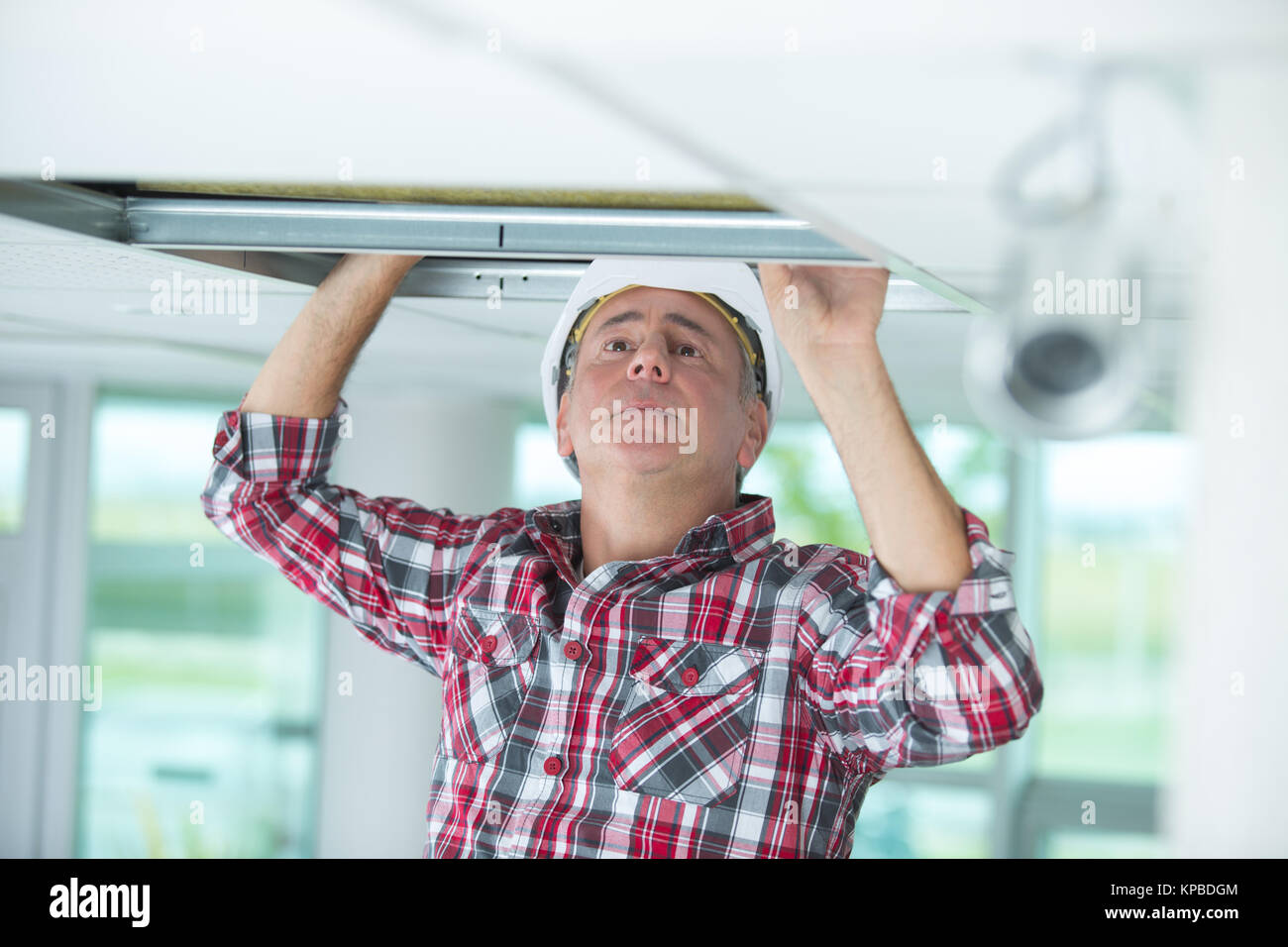 man repairing collapsed ceiling Stock Photo - Alamy