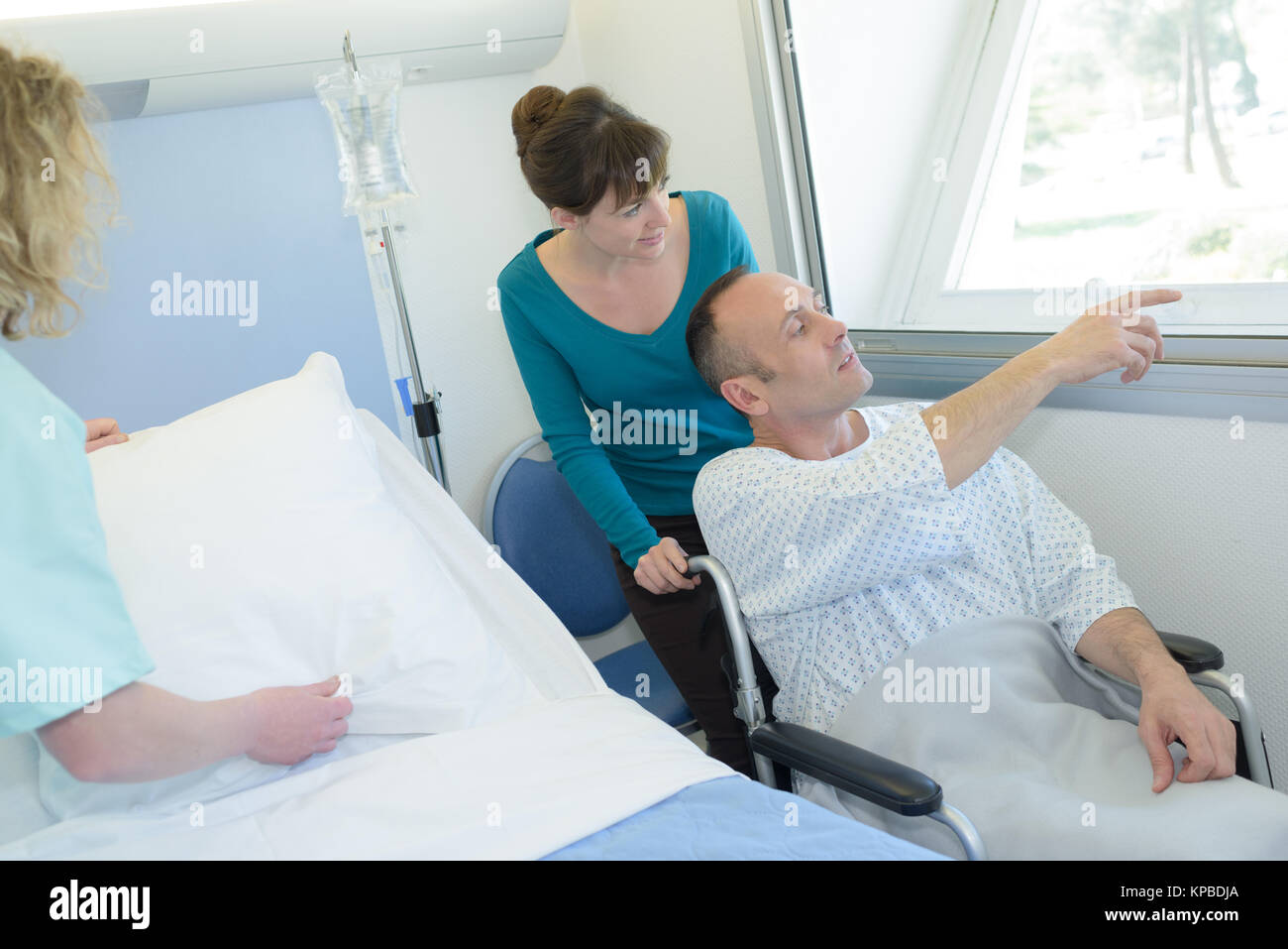 sick man on a wheelchair in hospital pointing outside window Stock ...