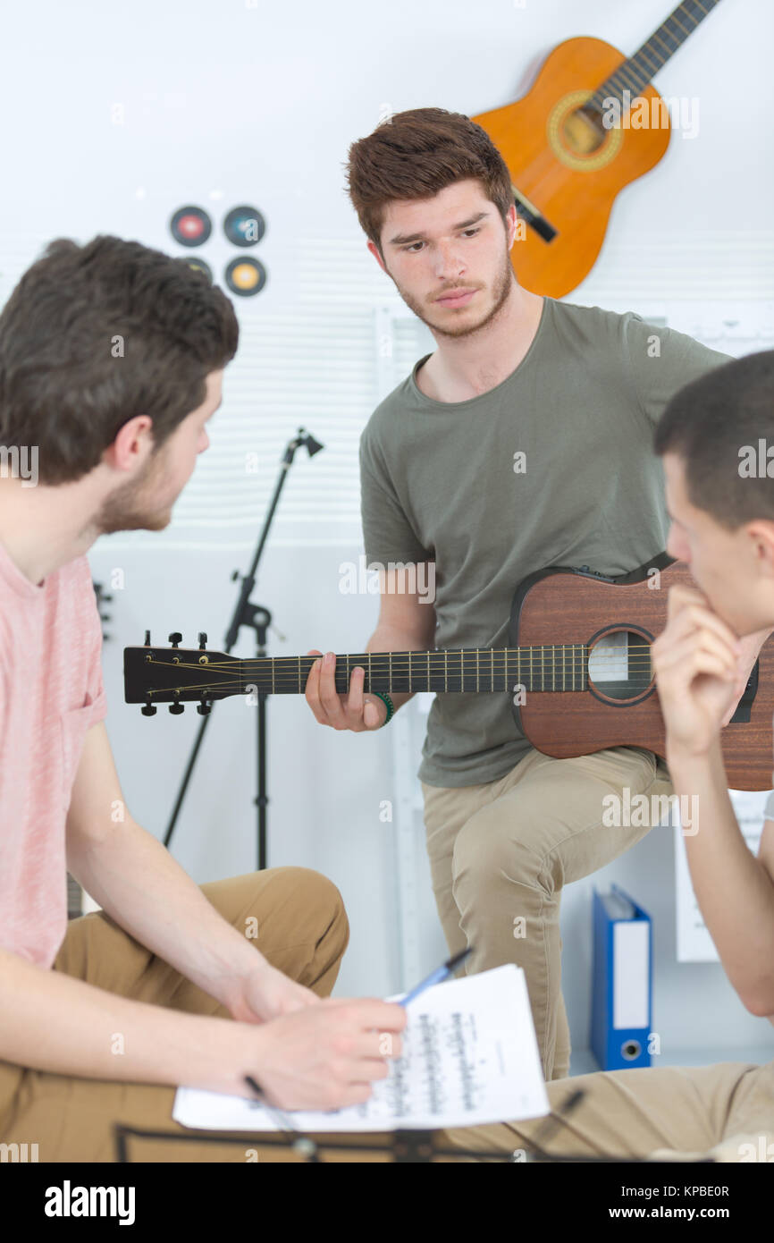 friends performing music in a recording studio Stock Photo - Alamy