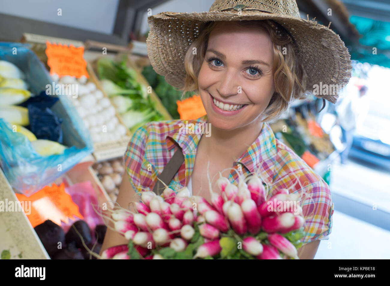 cheerful smiling fruit workers in fruit and vegetables section Stock ...