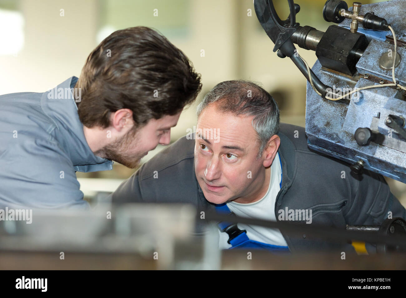apprentice mechanic working in auto repair shop Stock Photo - Alamy