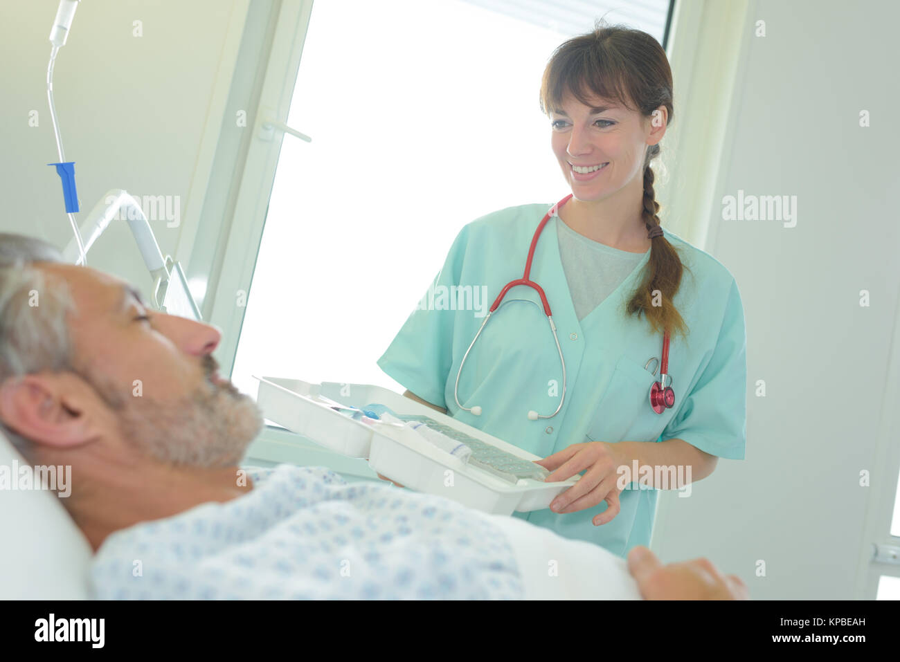 doctor visiting senior patient in hospital Stock Photo - Alamy