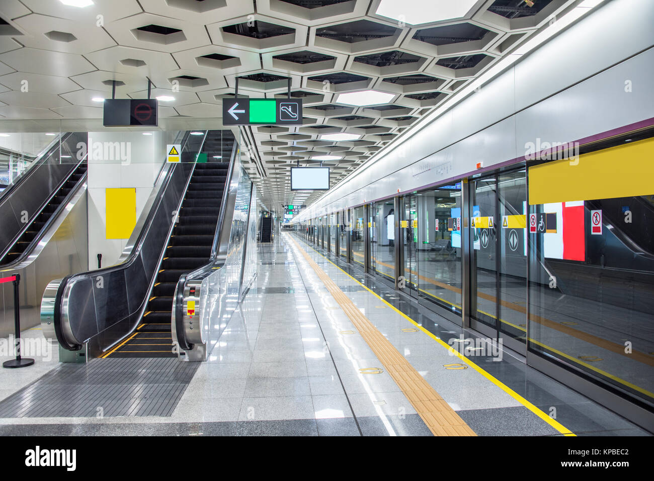 escalator and empty platform in underground subway station in Shanghai ...