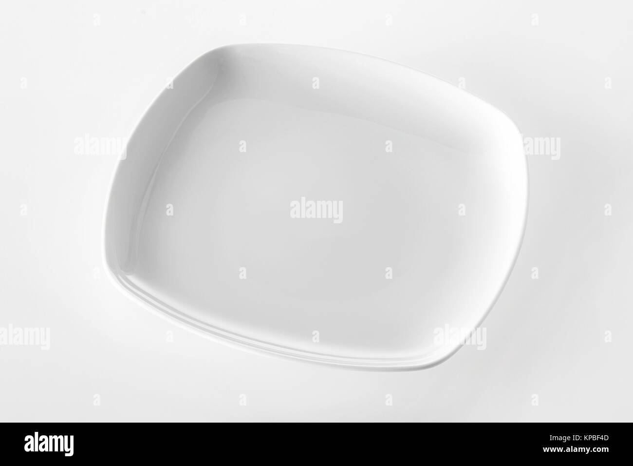 Empty plain white rectangular plate for serving dinner with copyspace ...