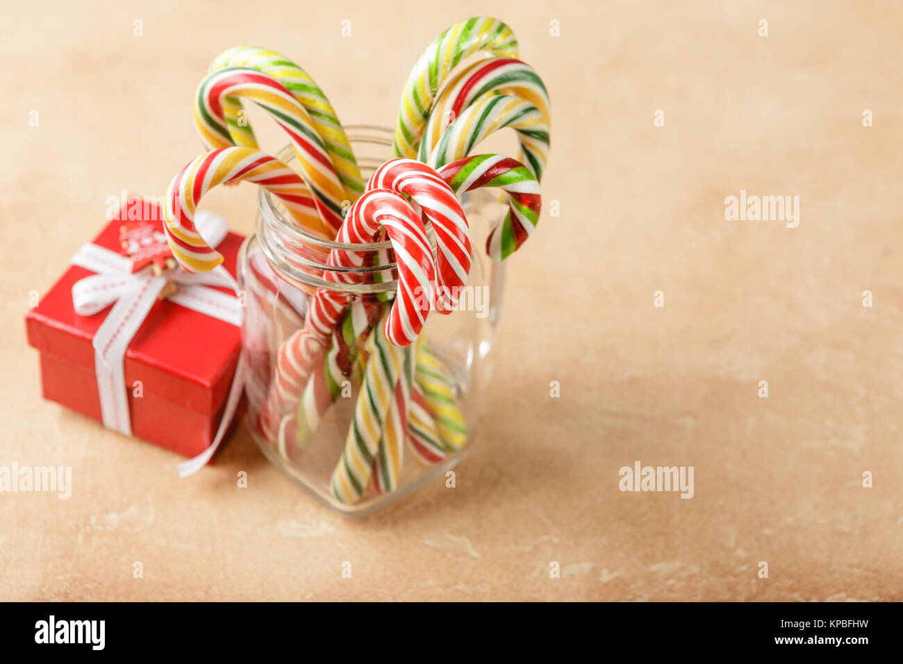 Christmas red gift boxes and Candy canes onblue background Stock Photo ...