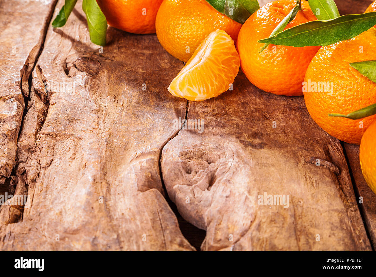 Fresh healthy citrus fruit displayed on a rustic wooden table with ...