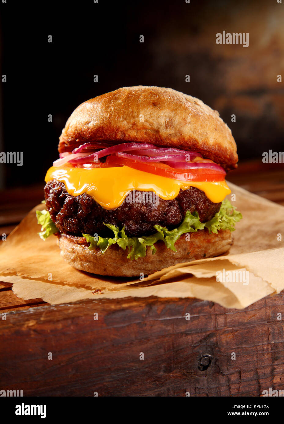 Tasty cheeseburger with fresh salad trimmings and a juicy thick beef ...