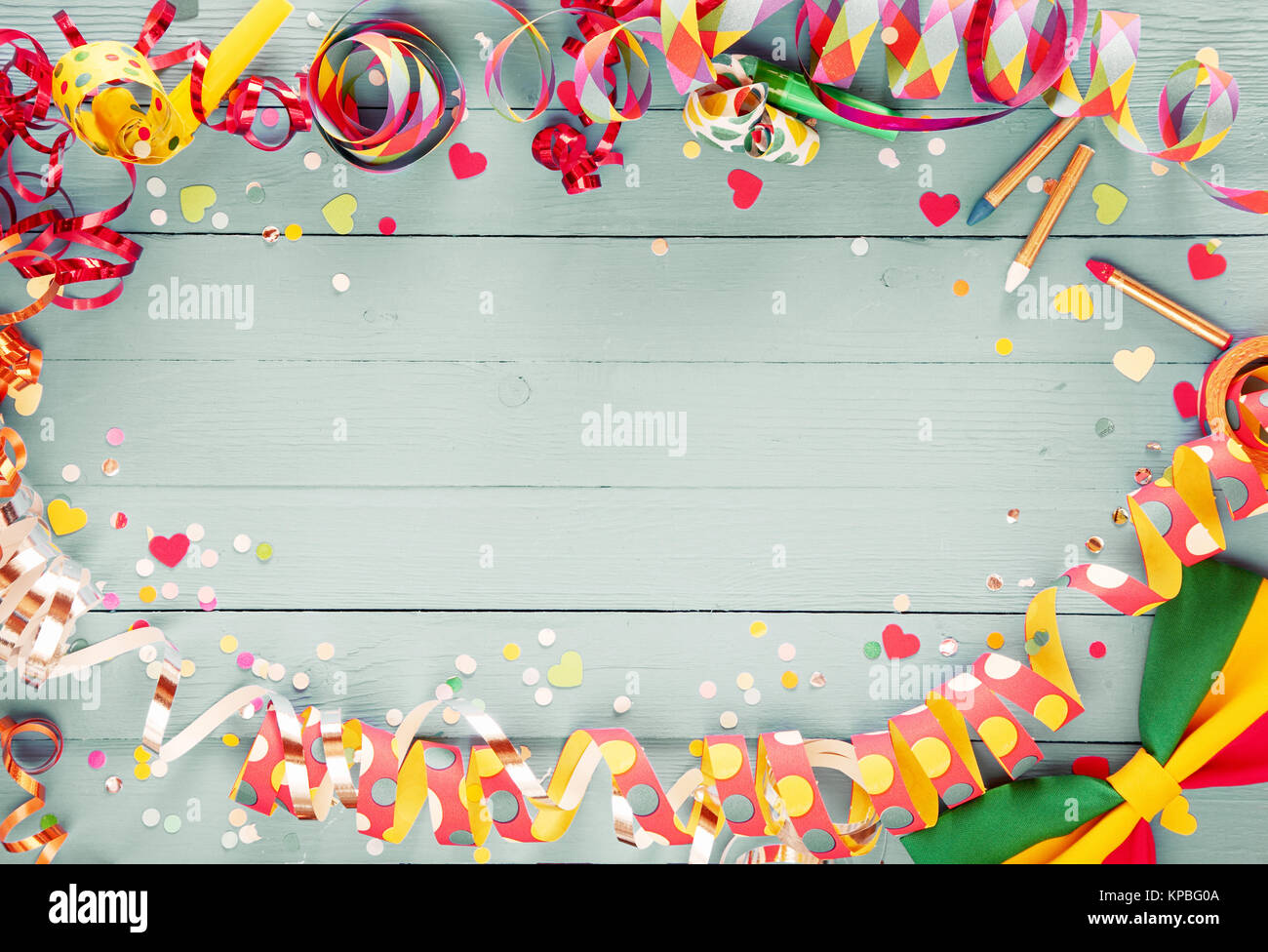 Colorful party frame with streamers and confetti and a vibrant bow tie ...